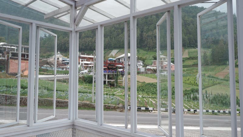 A Cafe Surrounded by Glass Windows with Views of the Hills Stock Photo ...