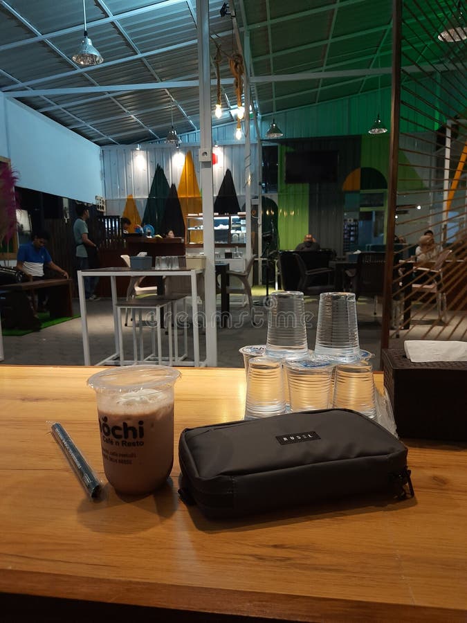 Cafe Table with a Cup Chocolate Milk and Some Glasses Mineral Water ...