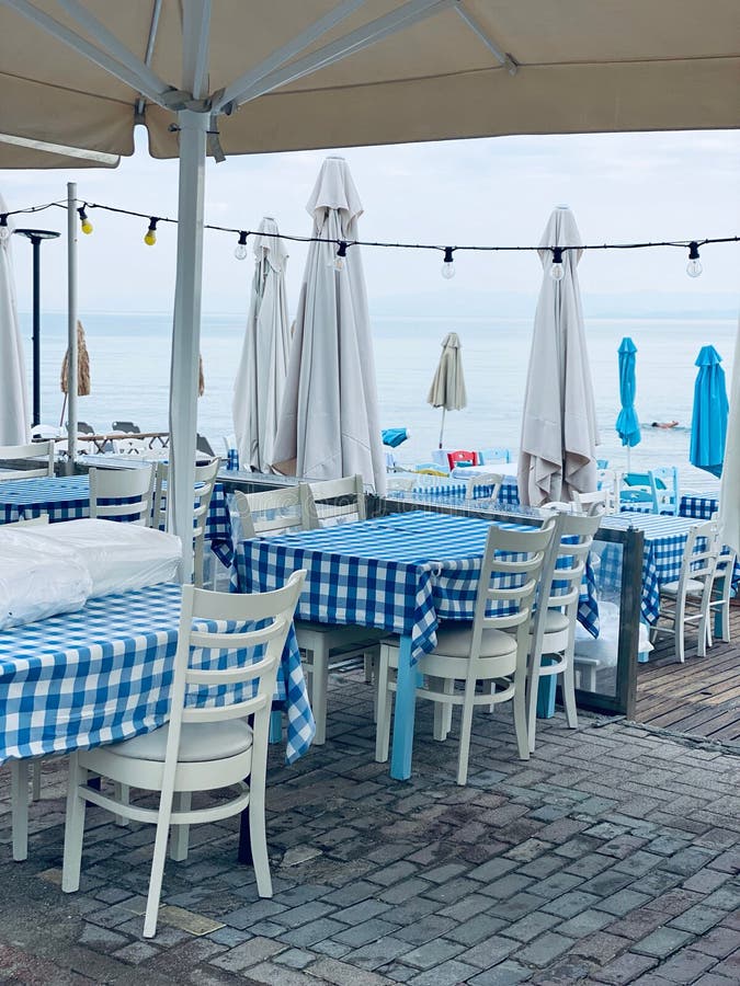 Cafe Tables and Chairs in Blue and White Colors on the Foot of the ...