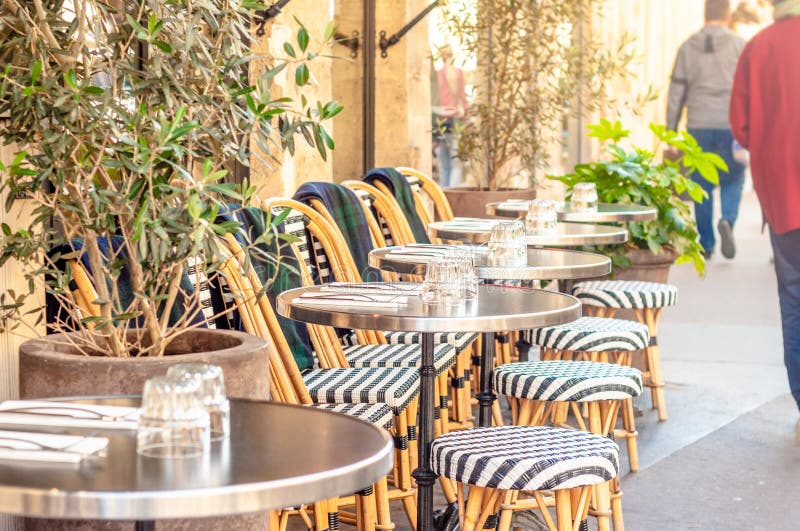 Cafe tables in Paris stock image. Image of france, furniture - 129958087
