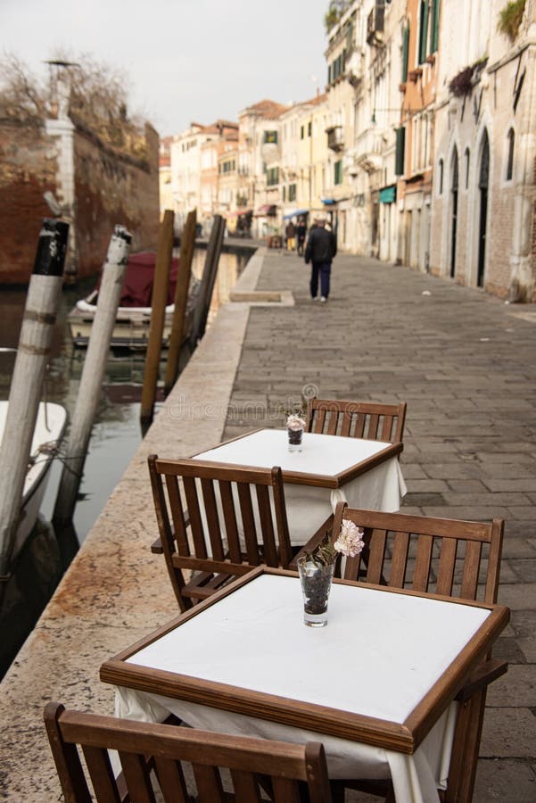 Cafe tables in Venice editorial photography. Image of venice - 345541187
