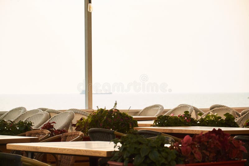 Cafe on the Terrace Near the Sea in Sunset Stock Photo - Image of city ...