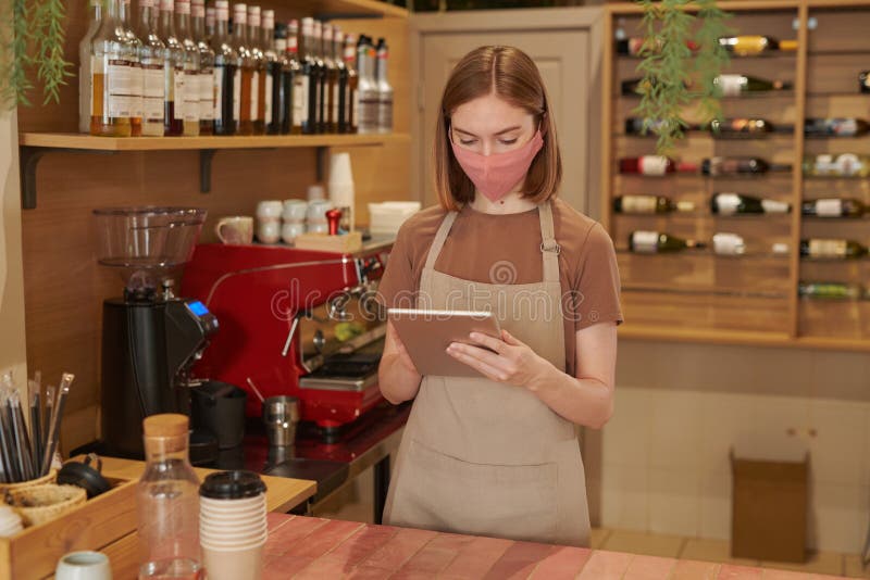Cafe Worker Checking Order stock image. Image of city - 244080279