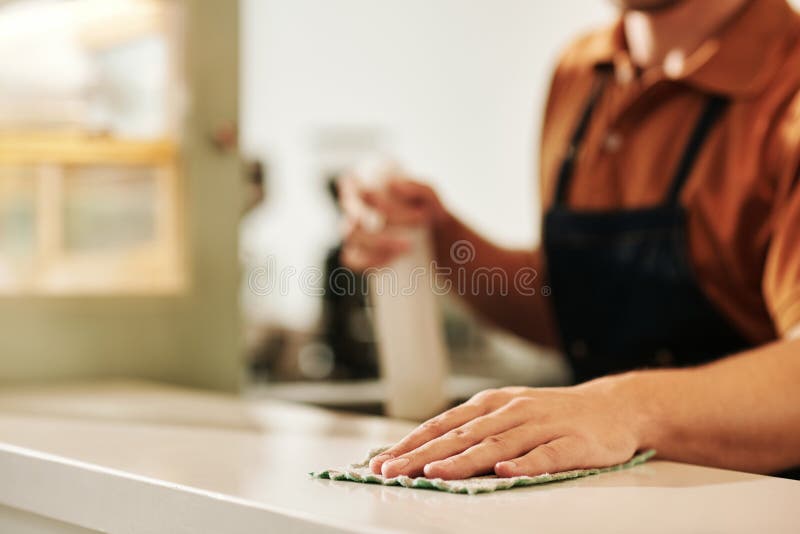 Cafe Worker Wiping Counter stock image. Image of dust - 255308149