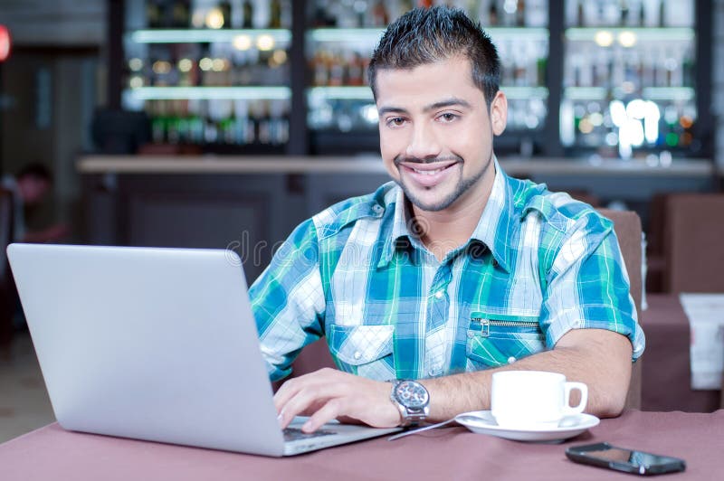 Smiling Guy Using Laptop Computer Stock Photo - Image of adult, indoors ...