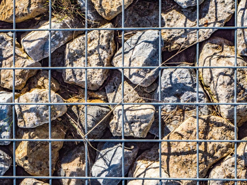 Rocks in a metal cage stock photo. Image of control, rock - 11559308