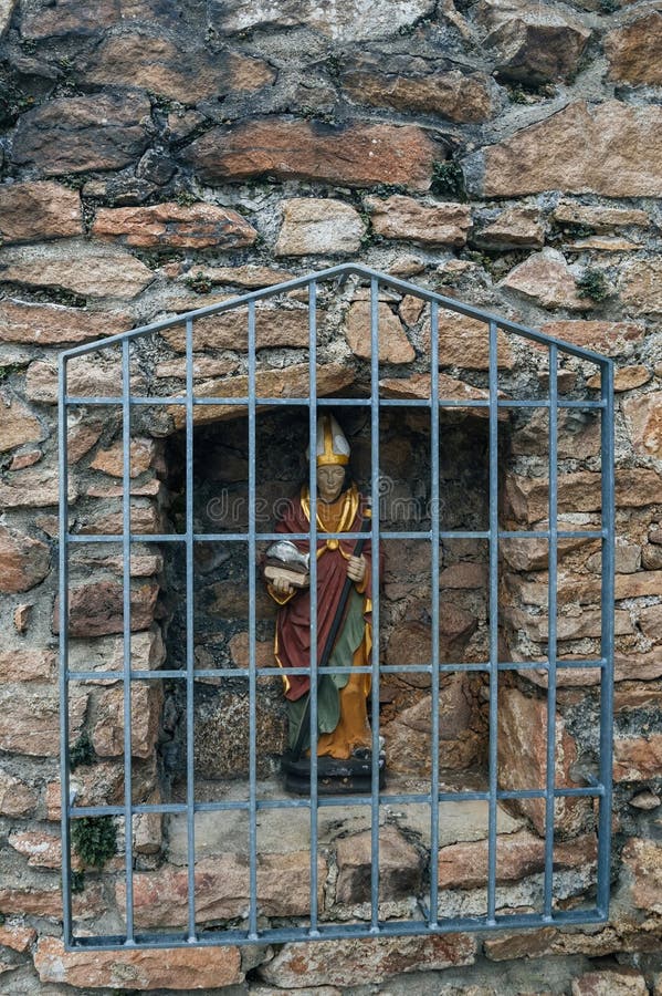 Caged Religious Statue in Stone Wall Stock Photo - Image of heritage ...