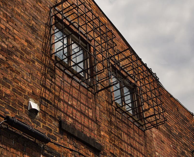 Cages Over Windows of an Abandoned Brick Industrial Building Stock ...