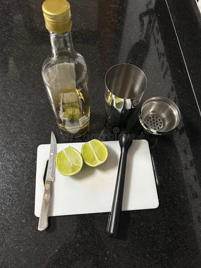 Caipirinha Set Cachaca Lemon Knife Muddler on a Black Granite Table ...