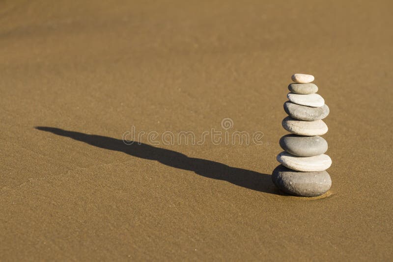 Cairn of Rounded Rocks on Wet Beach Sand Stock Photo - Image of white ...