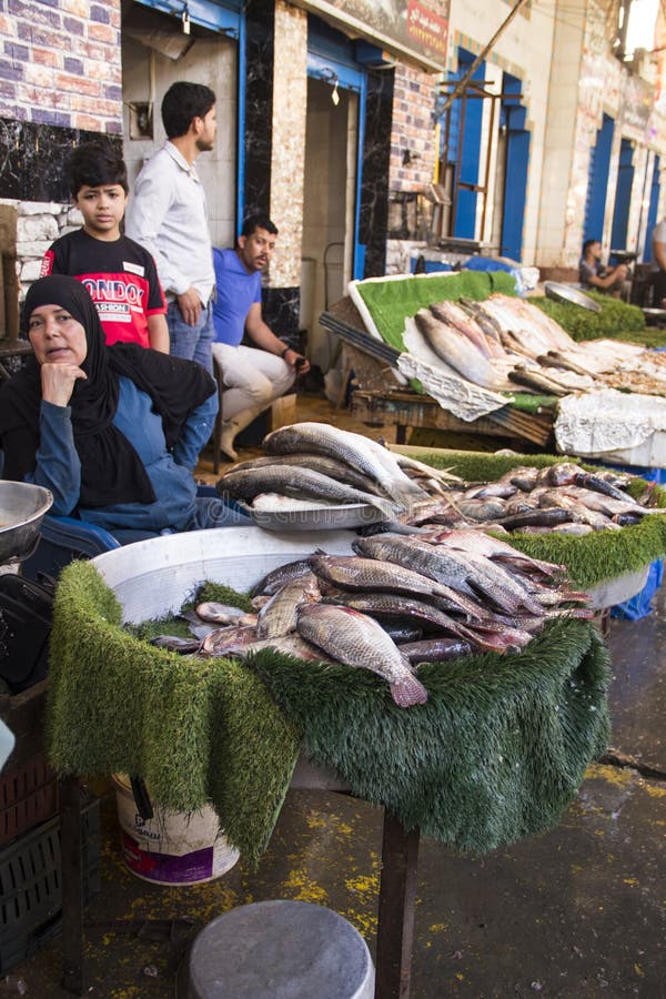 CAIRO, EGYPT - DECEMBER 29, 2021: Seller at the Central Fish Market in ...