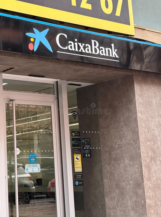 CaixaBank Storefront Showcasing Modern Banking Services, Inviting Customers with Its Vibrant ...