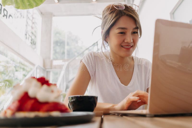 Cake Being Eat by Woman in the Cafe. Focus Selective on the Cake. Stock ...
