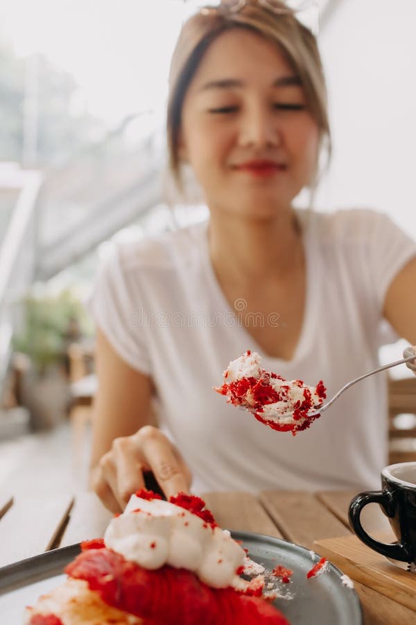 Cake Being Eat by Woman in the Cafe. Focus Selective on the Cake. Stock ...