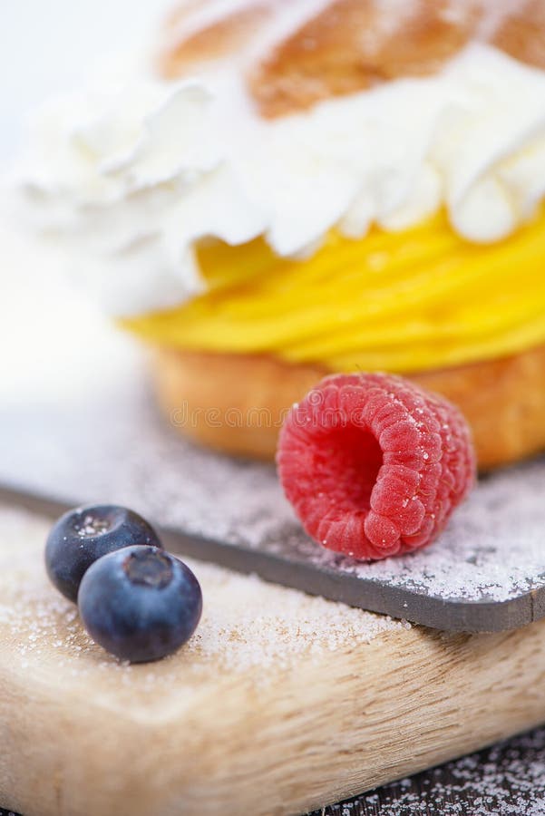 Cake with Biscuit and Berries and Sprinkle on a Substrate. Stock Photo ...