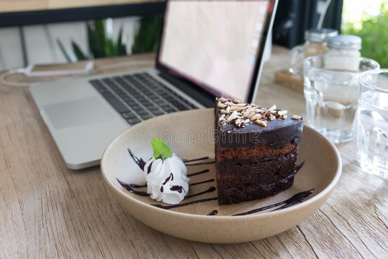 Cake Chocolate on Wood Table Work with Laptop Stock Image - Image of ...