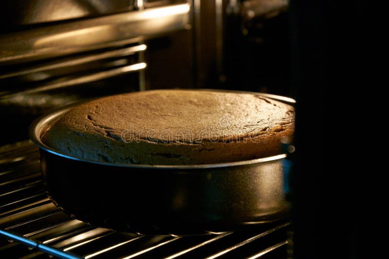 The Cake is Cooked in the Oven Stock Photo - Image of oven, ingredient ...
