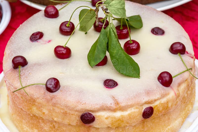 The Cake, Decorated with Cherries is on the Table. Stock Image - Image ...