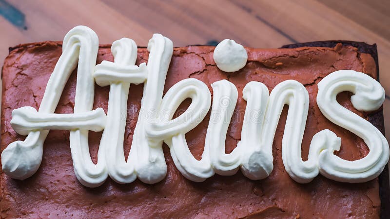 Cake with the Name Atkins Written in Large White Icing Stock Photo ...