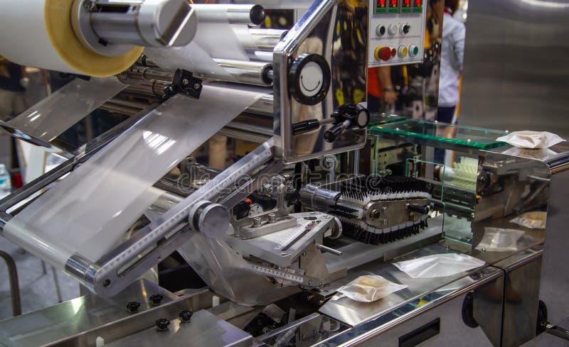 Cake packing machine stock photo. Image of manufacturing - 120933342