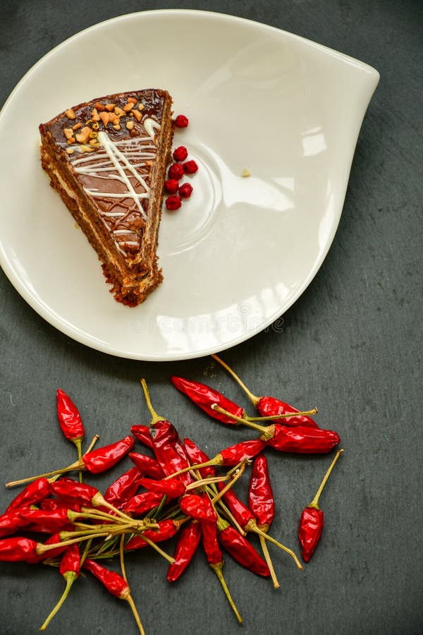Cake and red chili peppers stock image. Image of biscuits - 111663317