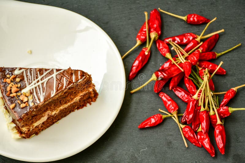 Cake and red chili peppers stock photo. Image of delicacy - 111663326
