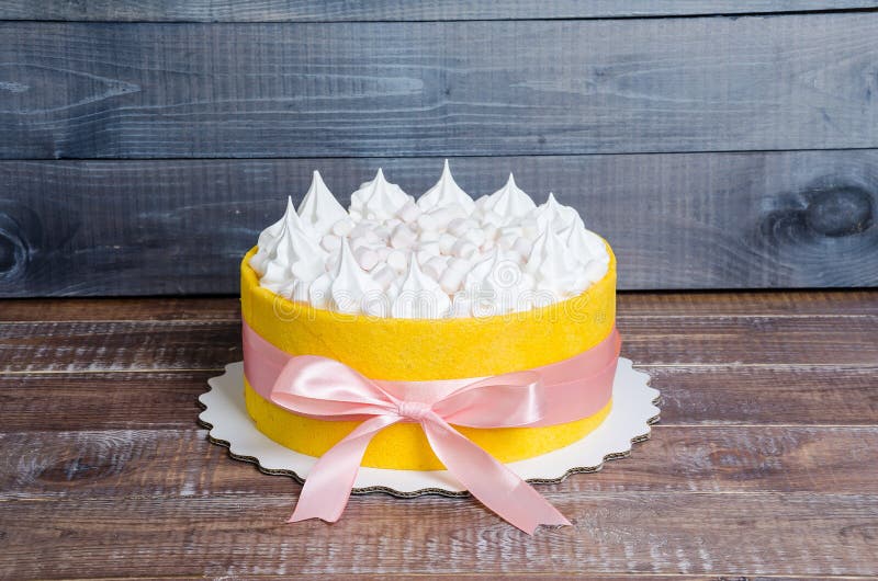 Cake Rolled in a Yellow Biscuit with Vanilla Merengue and Mars Stock ...