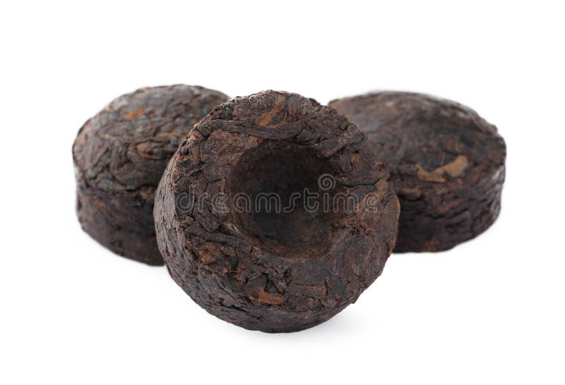 Cake Shaped Traditional Chinese Pu-erh Tea and Fresh Leaves Isolated on ...