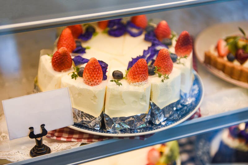 Cake on Shelf with Cake Strawberry and Blueberry on Store Bakery Shop ...