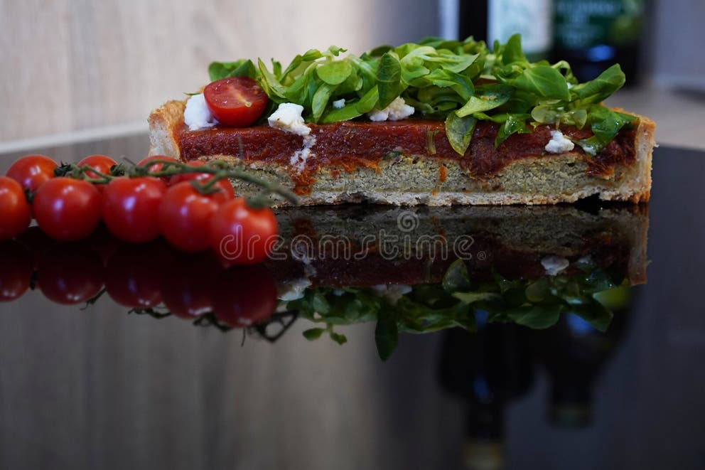 Cake Slice of Vegetables Lying on the Black Mirror Surface. Healthy ...