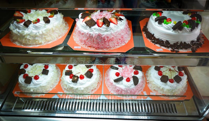 Cakes in a cake shop stock photo. Image of shelf, display - 102134012