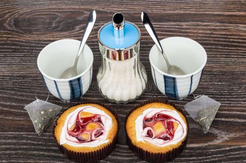 Cakes, Empty Cups, Tea and Sugar Bowl on Table Stock Image - Image of ...