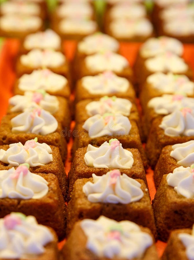 Cakes with Icing in Bakery Case Stock Photo - Image of pastries, cale ...