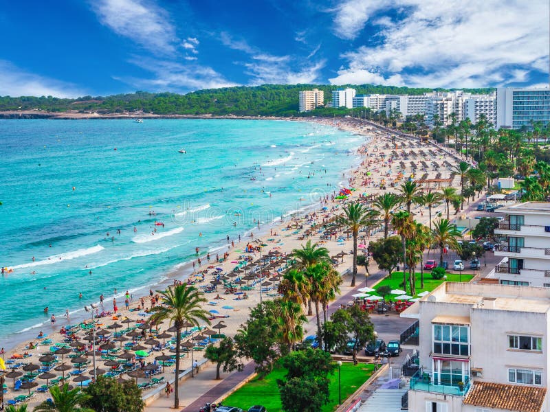 Cala Millor beach stock photo. Image of palm, sign, landscape - 215691352