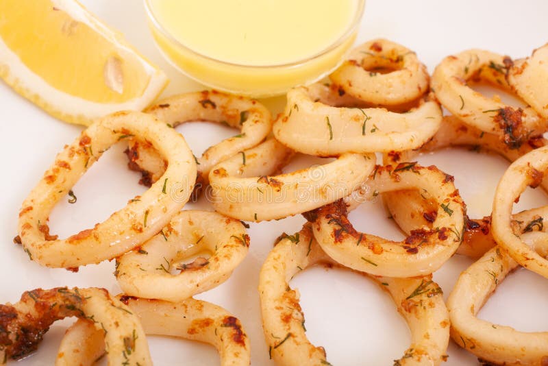 Calamari Rings, Squid Rings, with Sauce and Lemon Stock Photo - Image ...