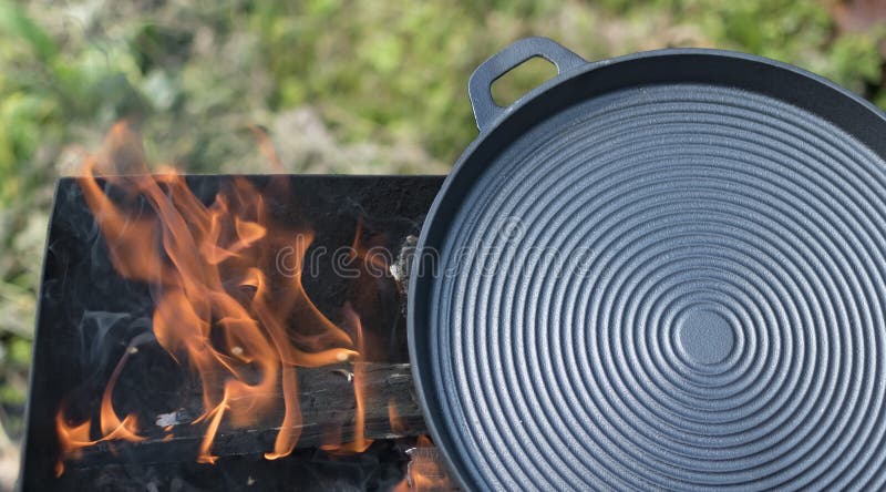 Calcining a New Frying Pan Over the Fire Stock Illustration ...