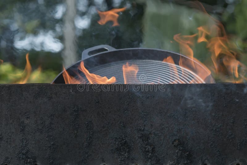 Calcining a New Frying Pan Over the Fire Stock Illustration ...