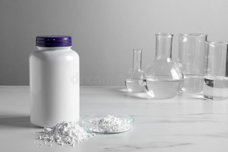 Calcium Carbonate Powder, Jar and Laboratory Glassware on White Marble ...