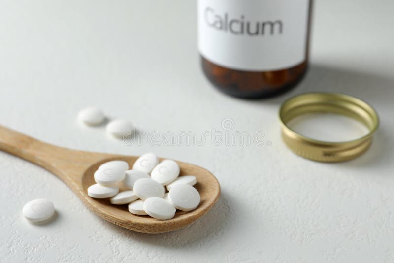 Calcium Supplement Pills on White Table, Closeup Stock Image - Image of ...