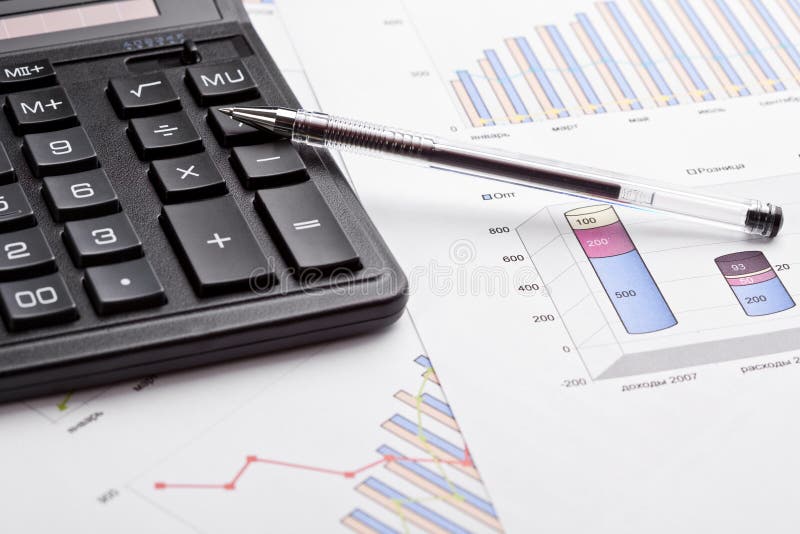 Calculating finances stock photo. Image of calculator - 12788676