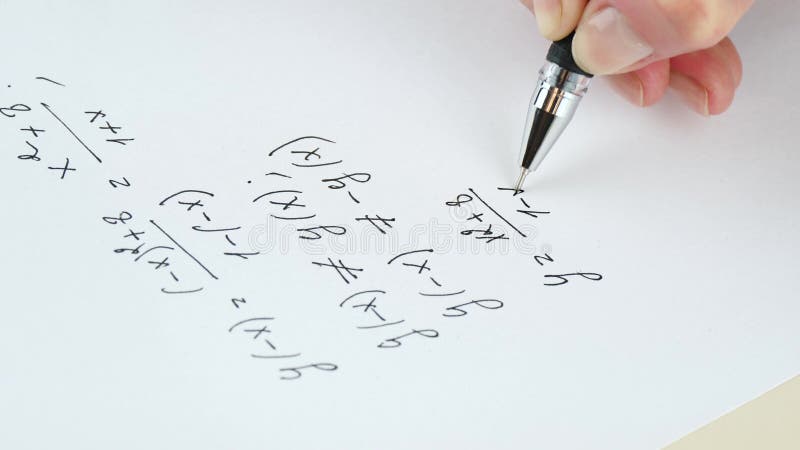 Calculation of Mathematical Formulas. a Close-up Hand Writes an ...