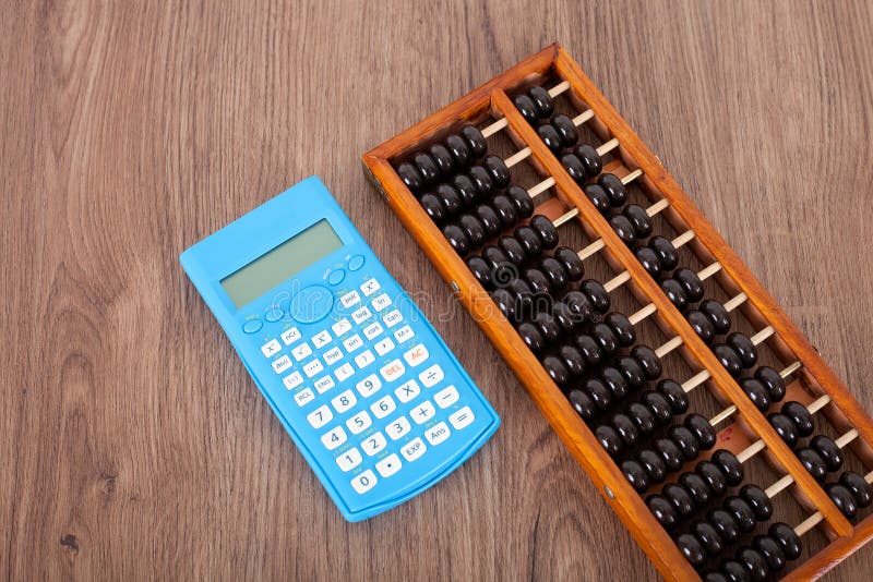 A calculator and an abacus stock photo. Image of item - 216974868