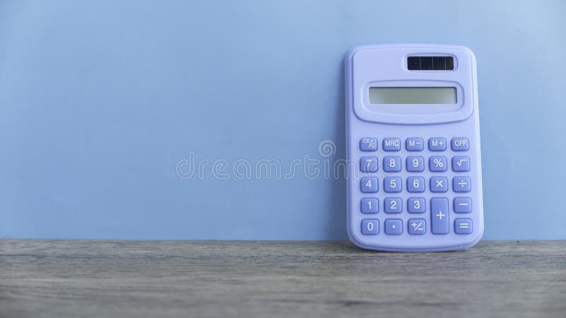 Calculator Against a Blue Wall with Copy Space Stock Image - Image of ...