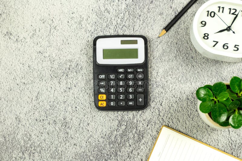 A Calculator, Alarm Clock and Pencil on the Desk. Stock Image - Image ...