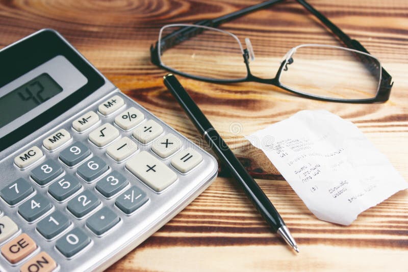 Pen, Calculator And Check Book On A Stack Of Bills Stock Image - Image ...