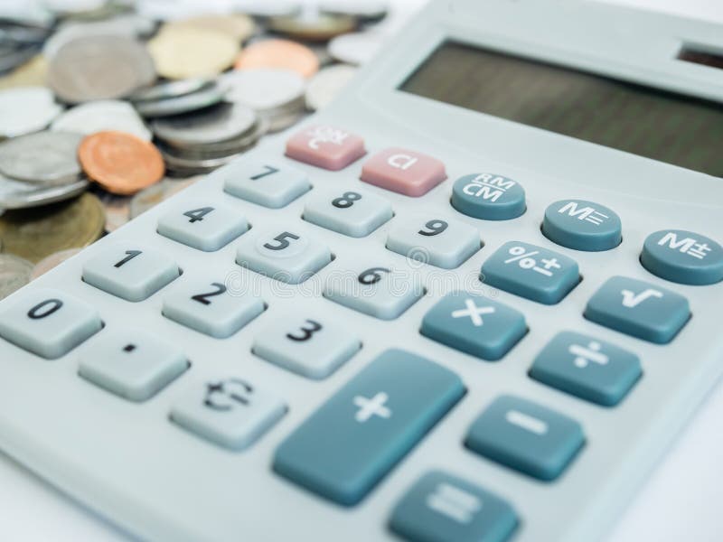 Calculator and coins stock image. Image of caculator - 67418391