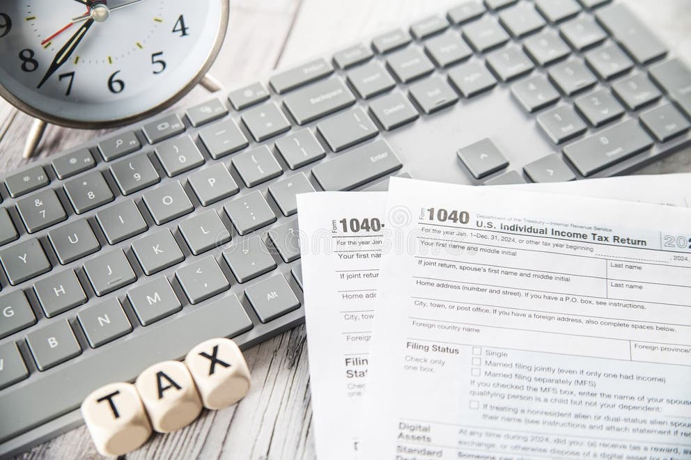 Calculator and Computer on the Table. Tax Deduction Planning Concept ...