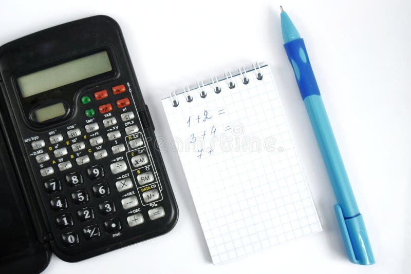 Calculator for Counting Examples in a Notebook with a Blue Pen on a ...