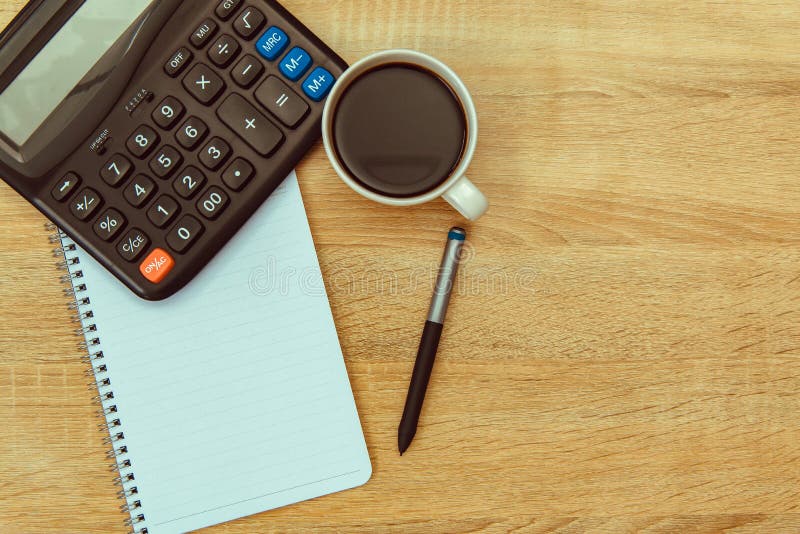 Calculator and Cup of Coffee with Note on Working Table with Cop Stock ...