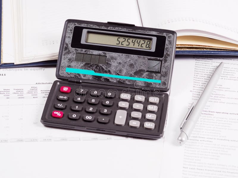 Calculator and Financial Documents on the Table Stock Photo - Image of ...